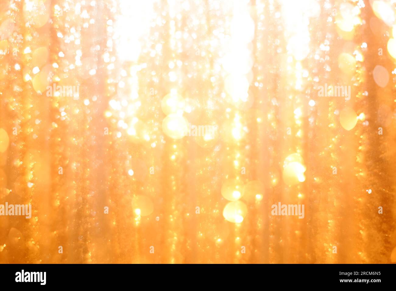 Abstract bokeh of sparkling gold glitter background or wallpaper Stock Photo - Alamy