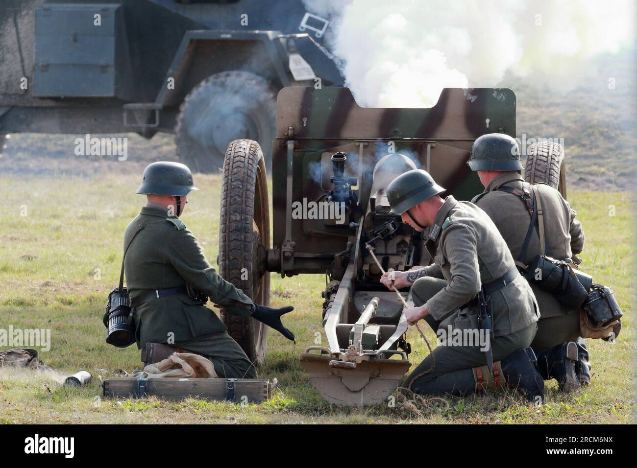 Historical reenactment of German Army soldiers with a field gun in the ...