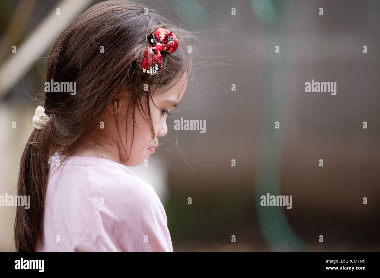 Portrait of sad kid girl close up view on blurred background Stock ...