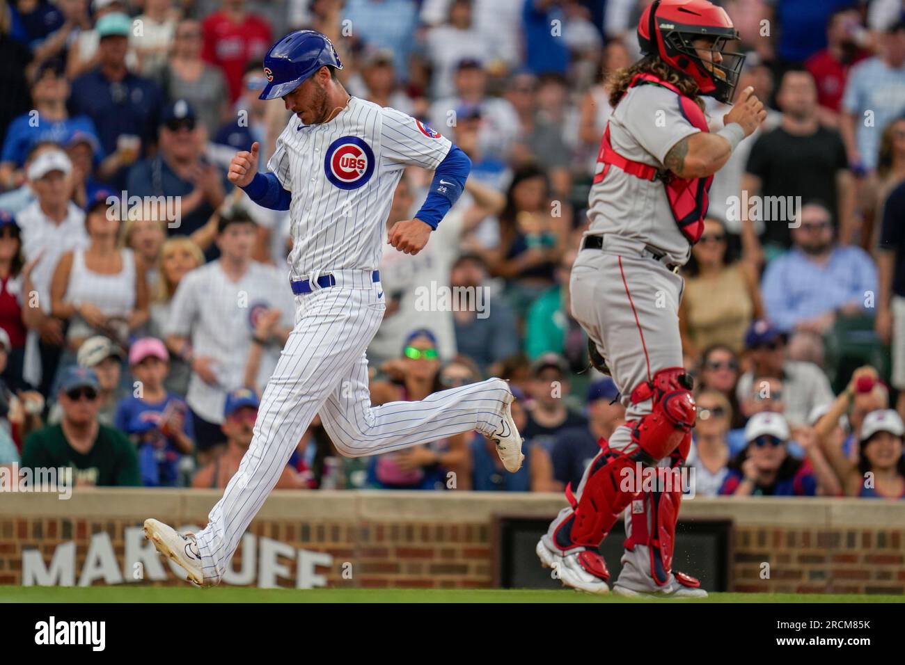 Chicago Cubs' Cody Bellinger, left, jogs past Boston Red Sox catcher ...