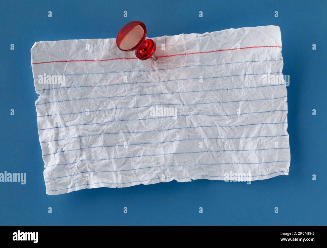 Worn and faded index card pinned with red tack. Blank copy space for ...