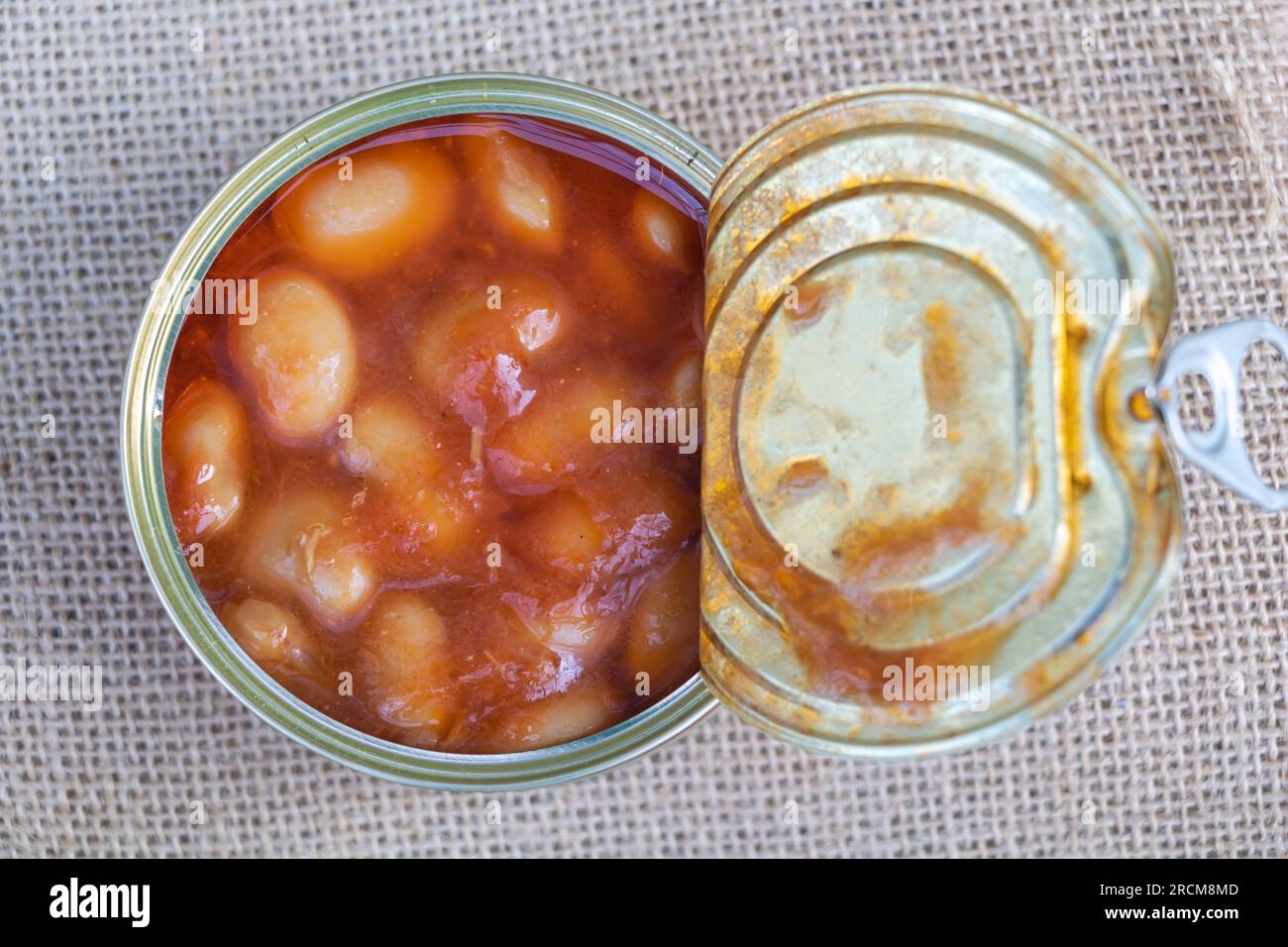 Baked beans in tomato sauce in a tin can on burlap Stock Photo - Alamy