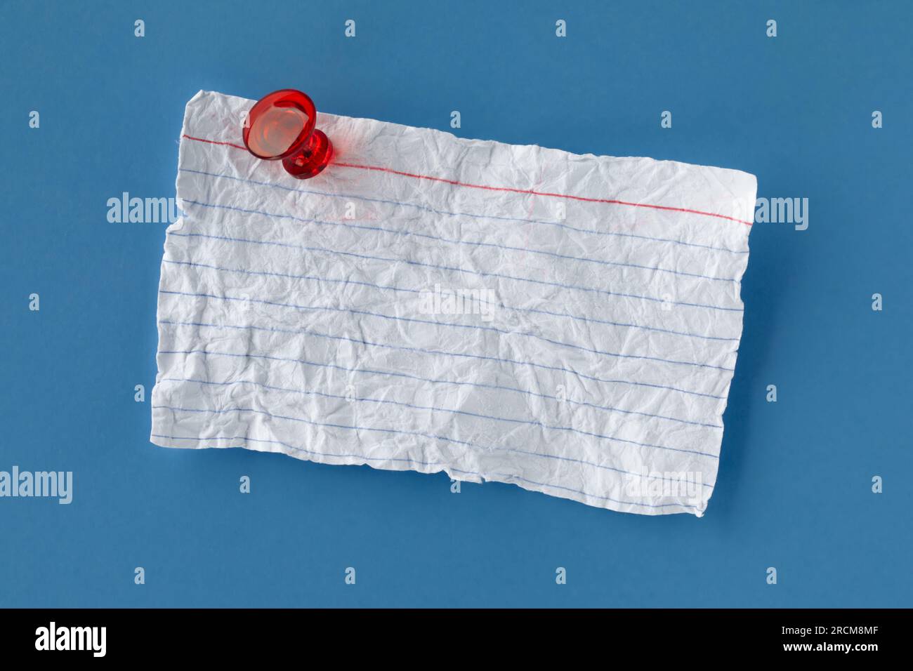 Worn and faded index card pinned with red tack. Blank copy space for ...