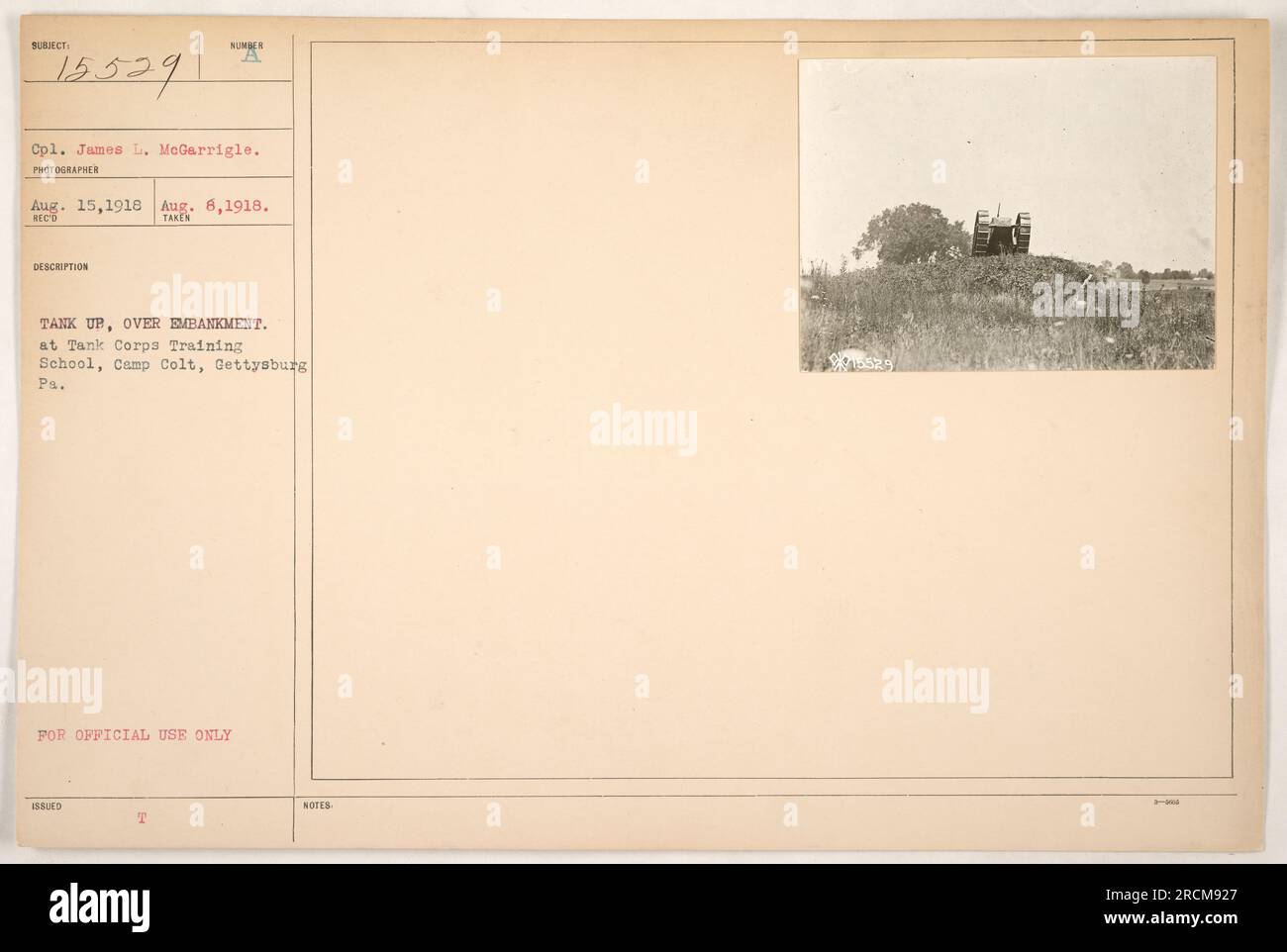 Cpl. James L. McGarrigle navigating a tank over an embankment during ...