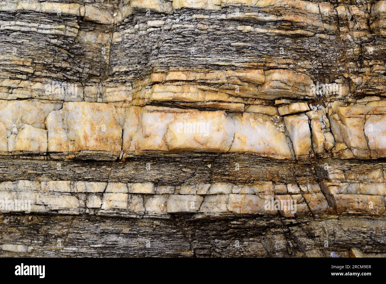 Layers of different crustal rock material Stock Photo - Alamy