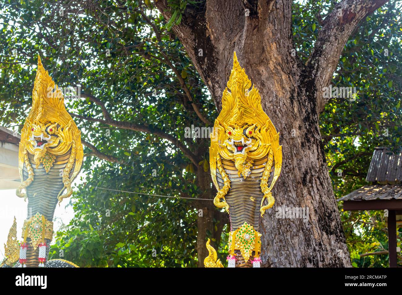 Painted ornate snake statues in a Buddhist temple. Culture of Asia ...