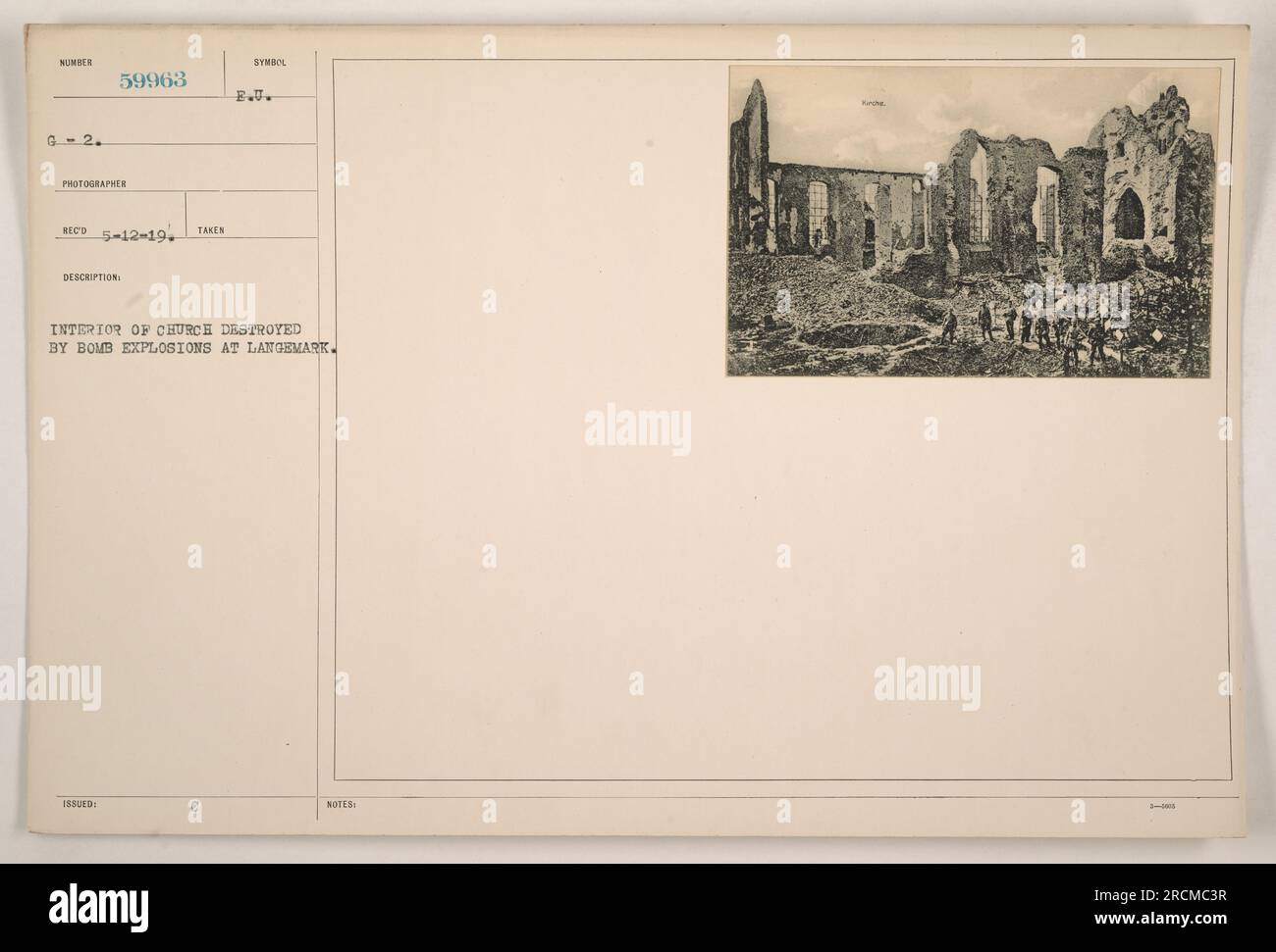 group soldiers stand inside a damaged church. The interior walls are ...