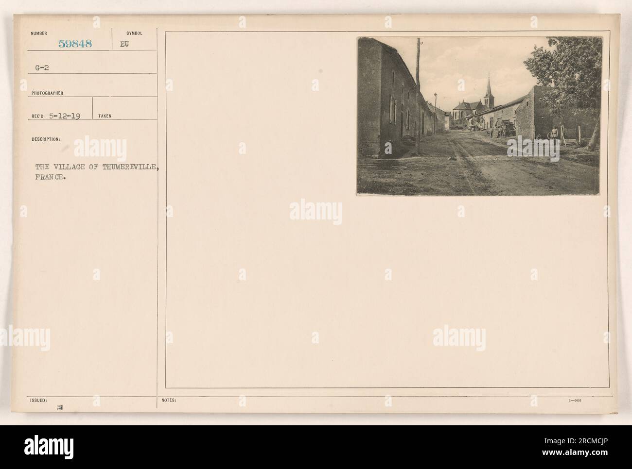 American soldiers patrolling the streets of Thumereville, France during ...