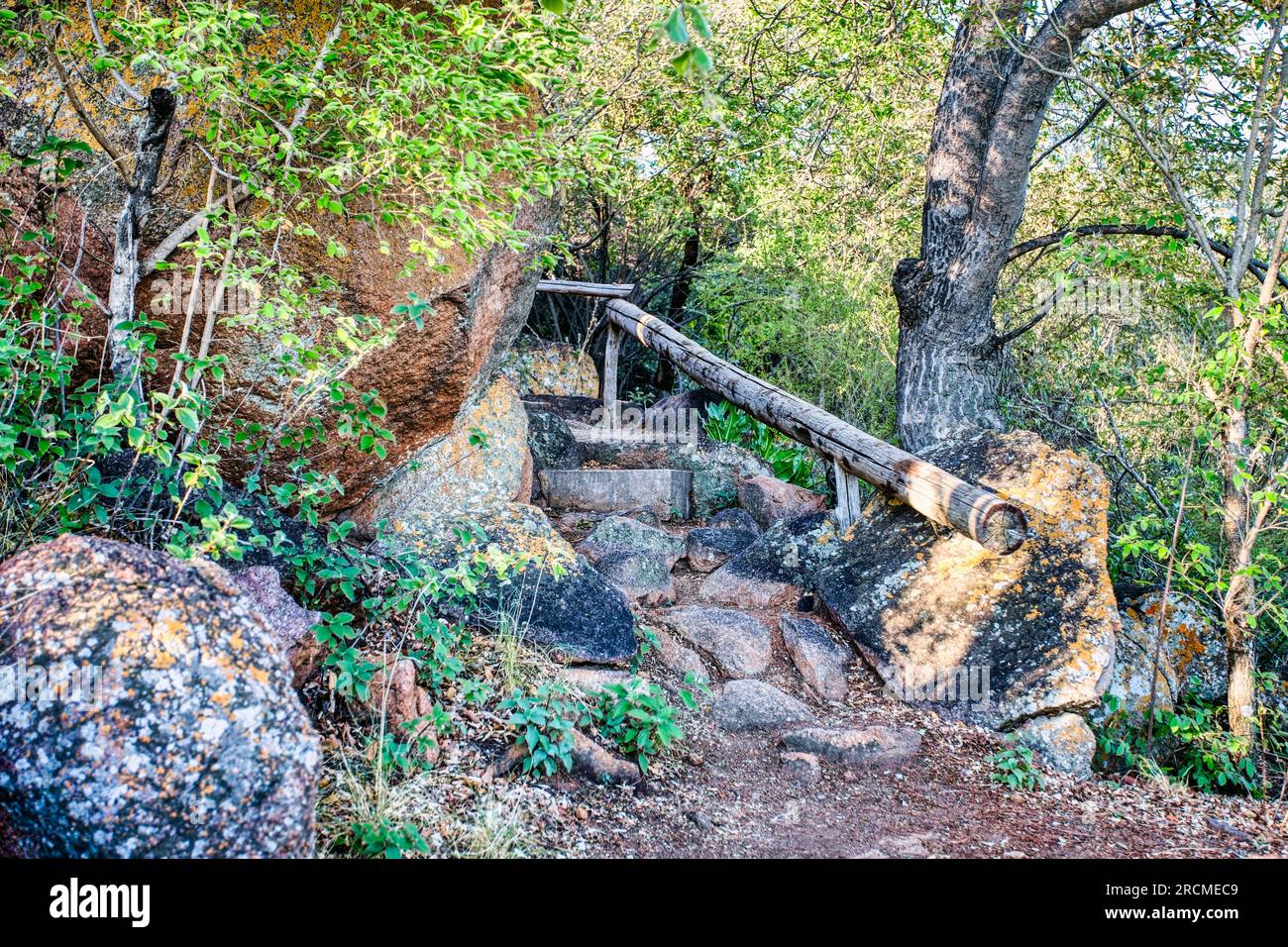 old rocky staircase with wooden balustrade for hikers and climbers in ...