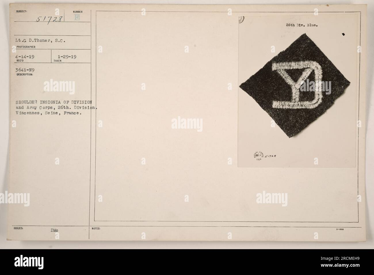 Shoulder insignia of the 26th Division and Army Corps. The photograph ...