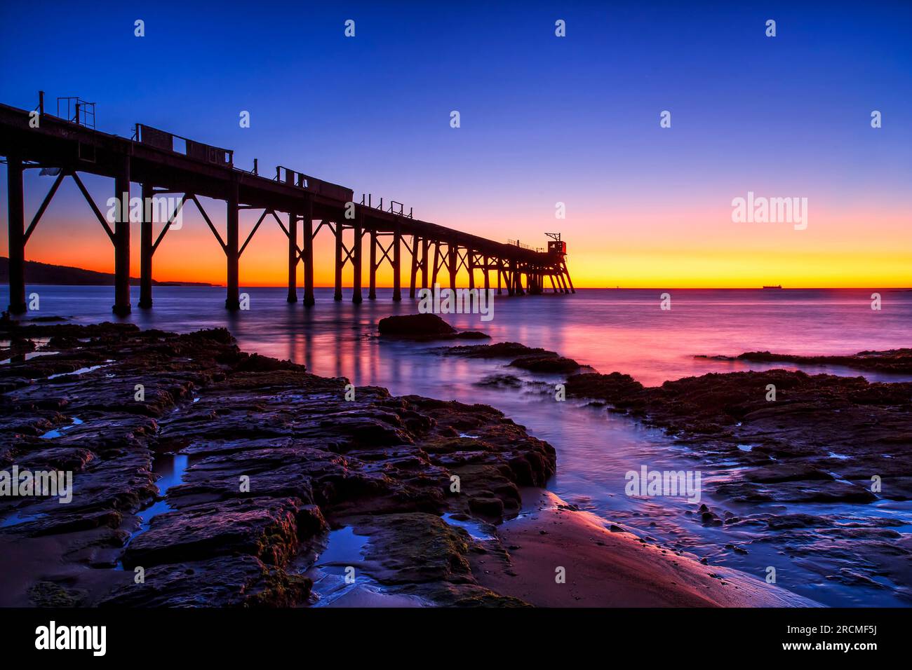 Historic Catherine Hill bay jetty at Middle Camp beach on Pacific coast ...