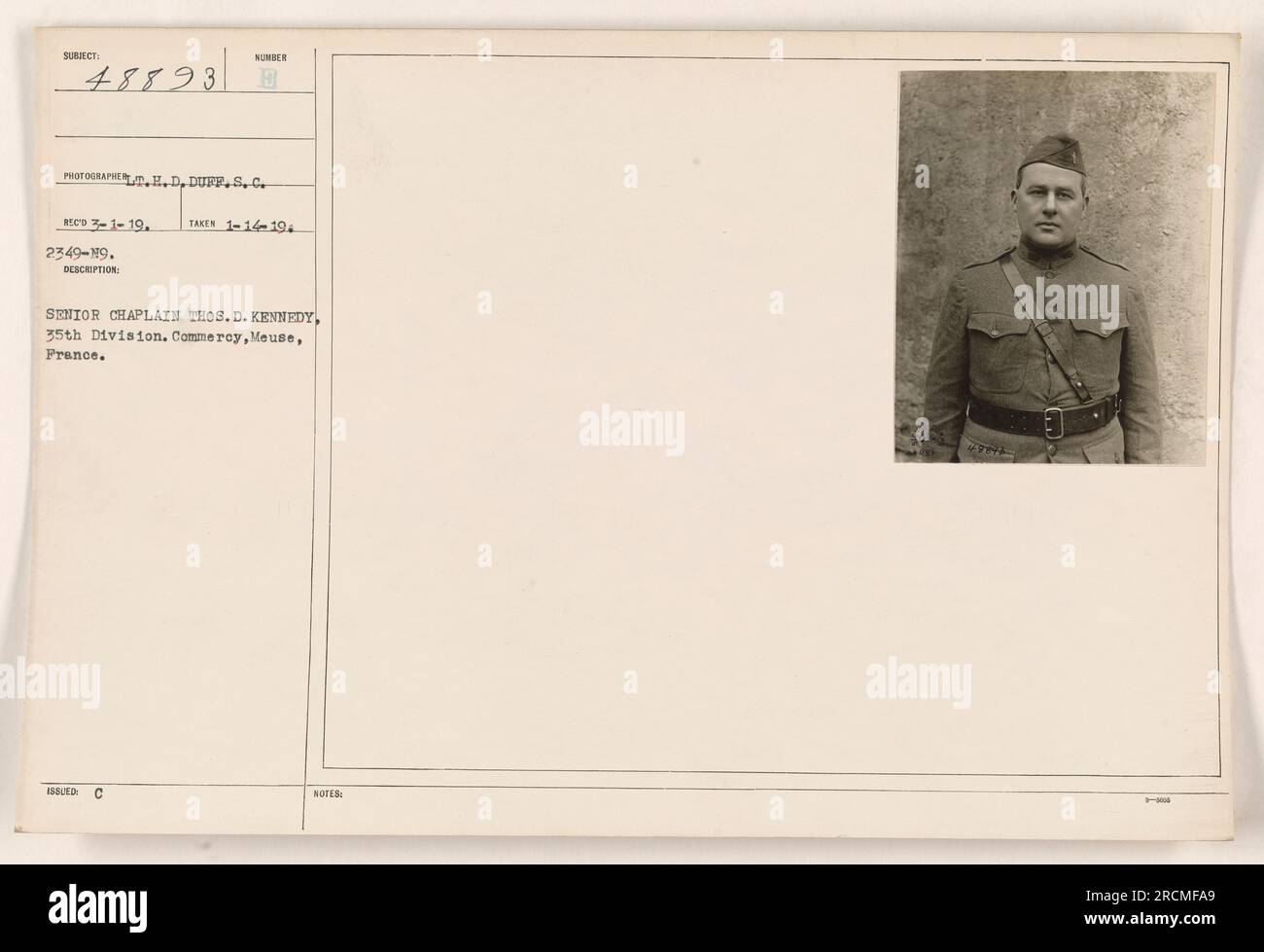 Senior Chaplain Thomas D. Kennedy of the 35th Division is photographed ...