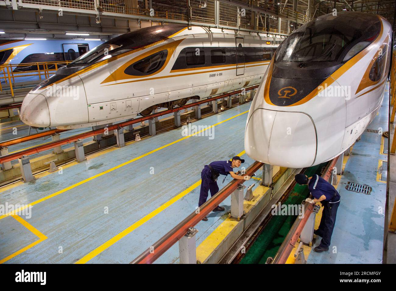 NANJING, CHINA - JULY 16, 2023 - Two ground service mechanics inspect a ...