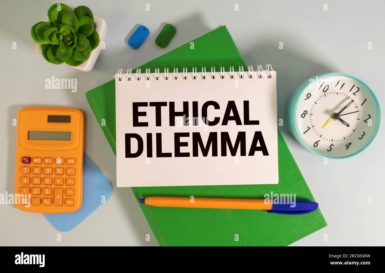 clipboard with white blank paper text ethical dilemma , calculator and ...