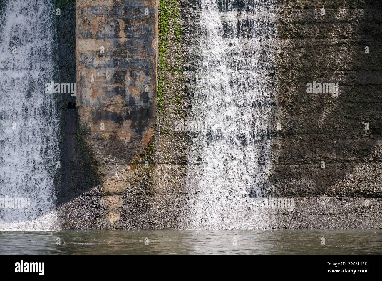 Spillways from old hydroelectric dam flow Stock Photo - Alamy
