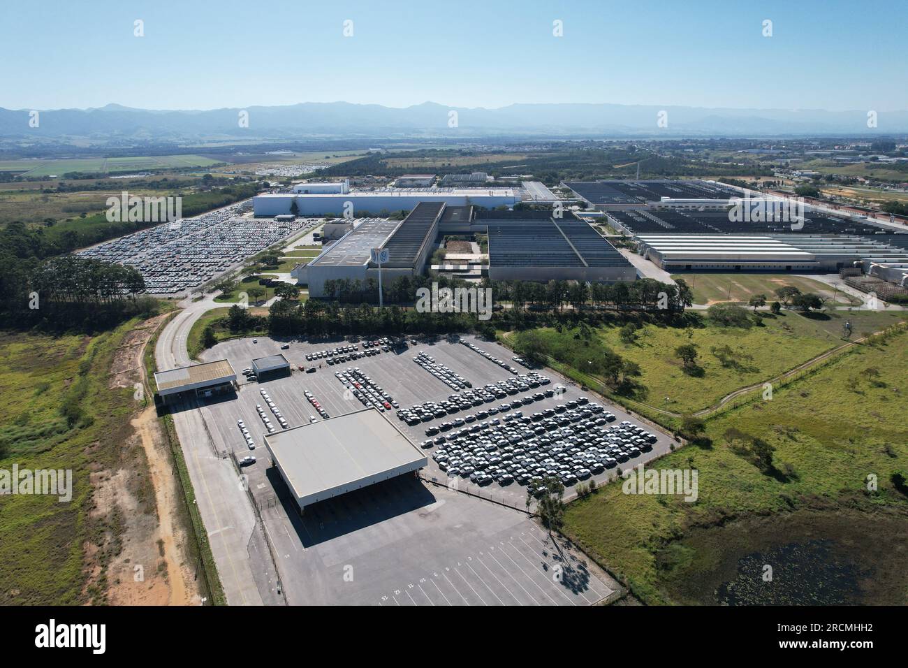 Aerial view of new cars stock at factory parking crowded lot ...