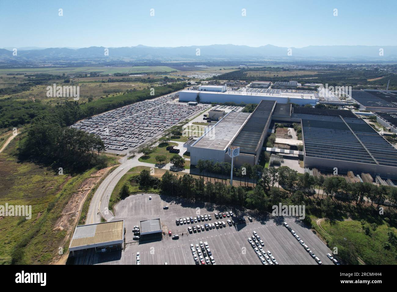 Aerial view of new cars stock at factory parking crowded lot ...