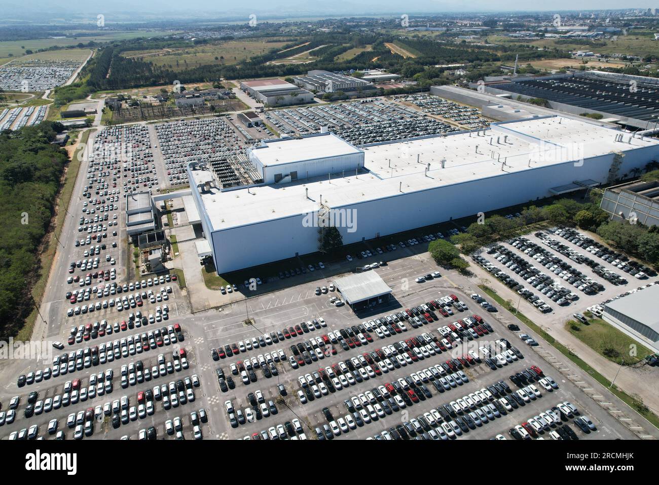 Aerial view of new cars stock at factory parking crowded lot ...