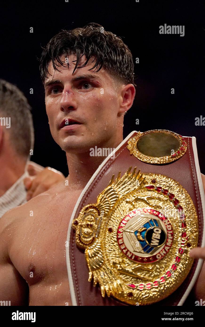 Josh Kelly poses with his title belt after being announced as winner by ...