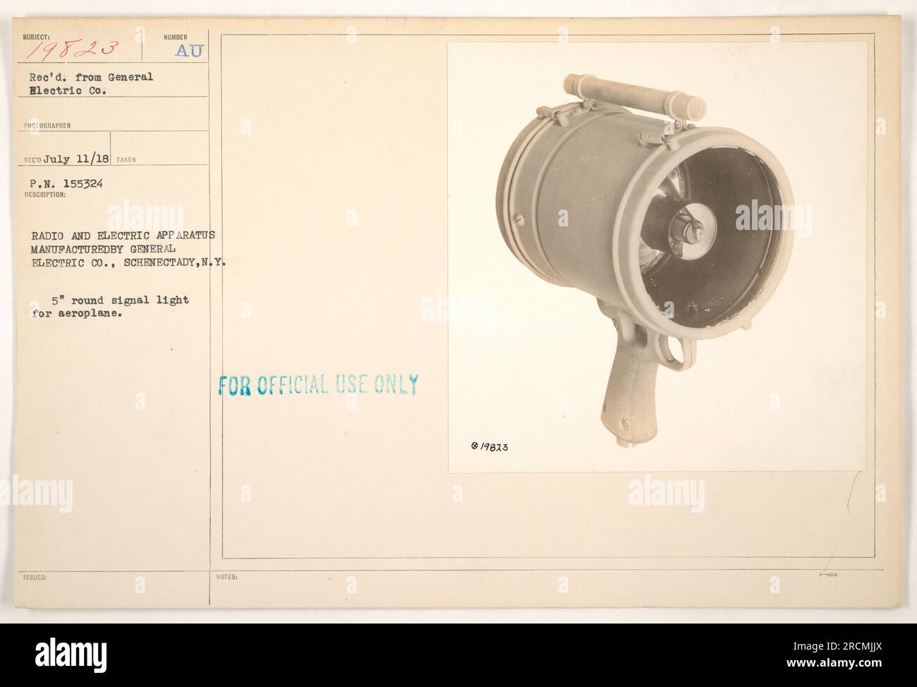 This photograph shows a round signal light manufactured by the General ...