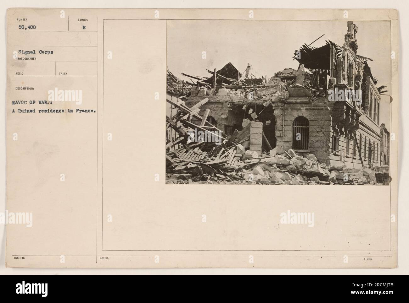 This photograph captures the aftermath of war, showing a partially ...