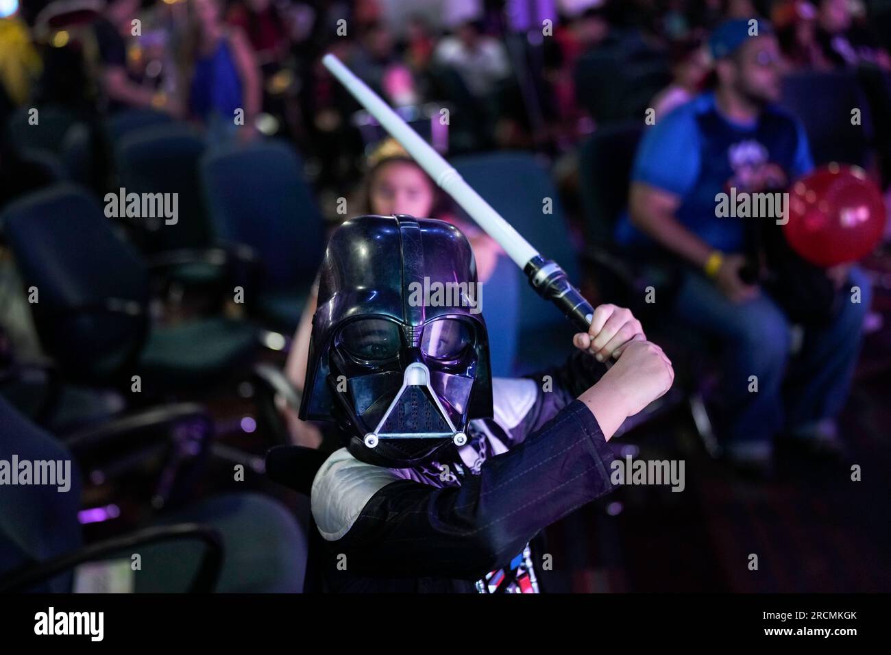 A cosplayer dressed in a Darth Vader character costume attends the ...