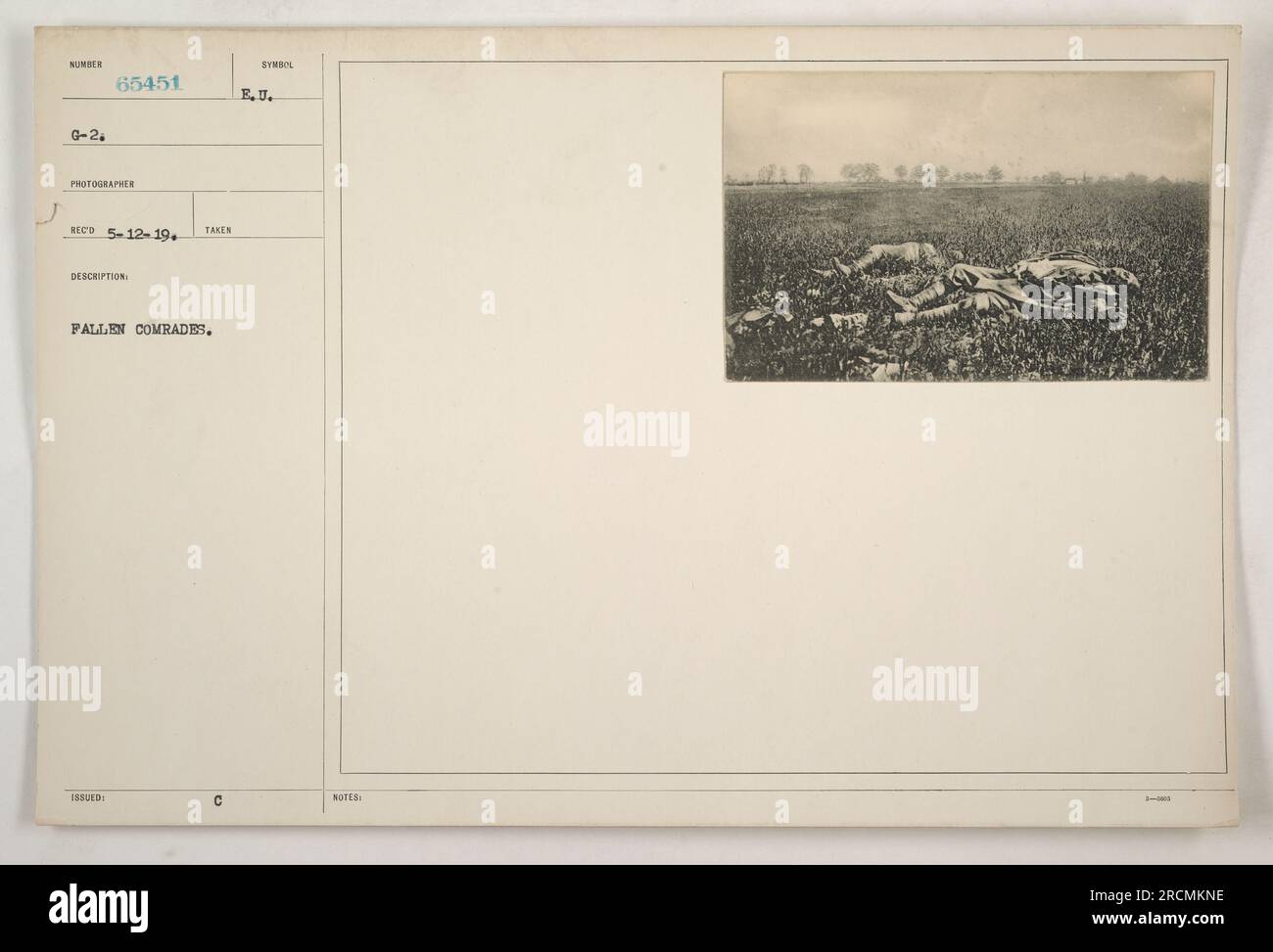 Group of soldiers paying tribute to fallen comrades in a cemetery ...
