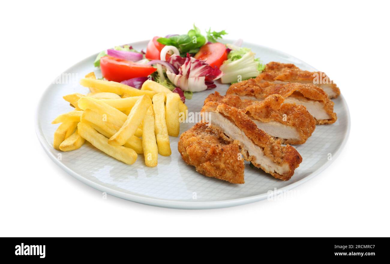 Plate of delicious cut schnitzel with french fries and vegetable salad ...