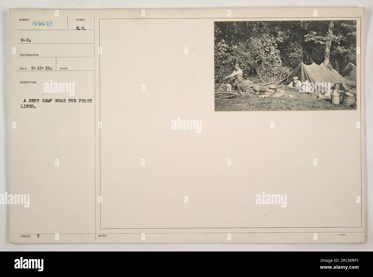 A group of soldiers rest at a camp located near the front lines during ...