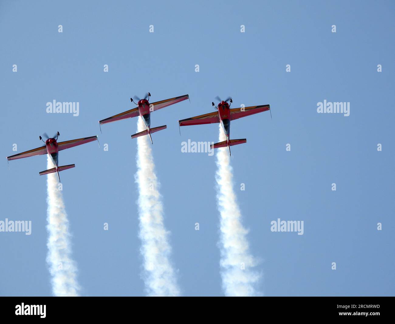 Three warplanes conducting an air show (smoke comes out of them) planes ...