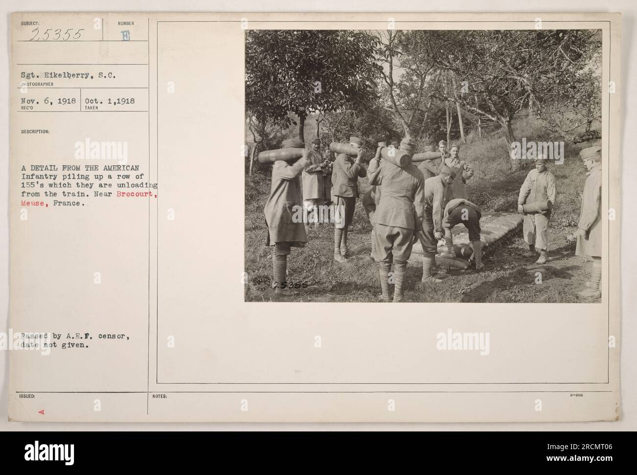 American infantry soldiers unloading a row of 155mm artillery shells ...