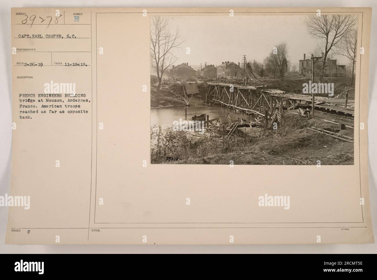 American soldiers observe as French engineers construct a bridge at ...