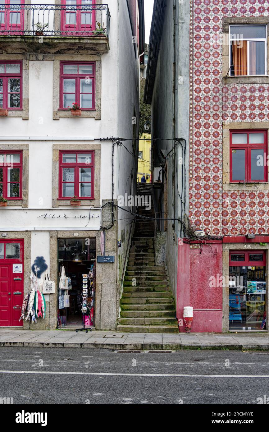 Narrow and steep passage with steps between two buildings in Gaia ...