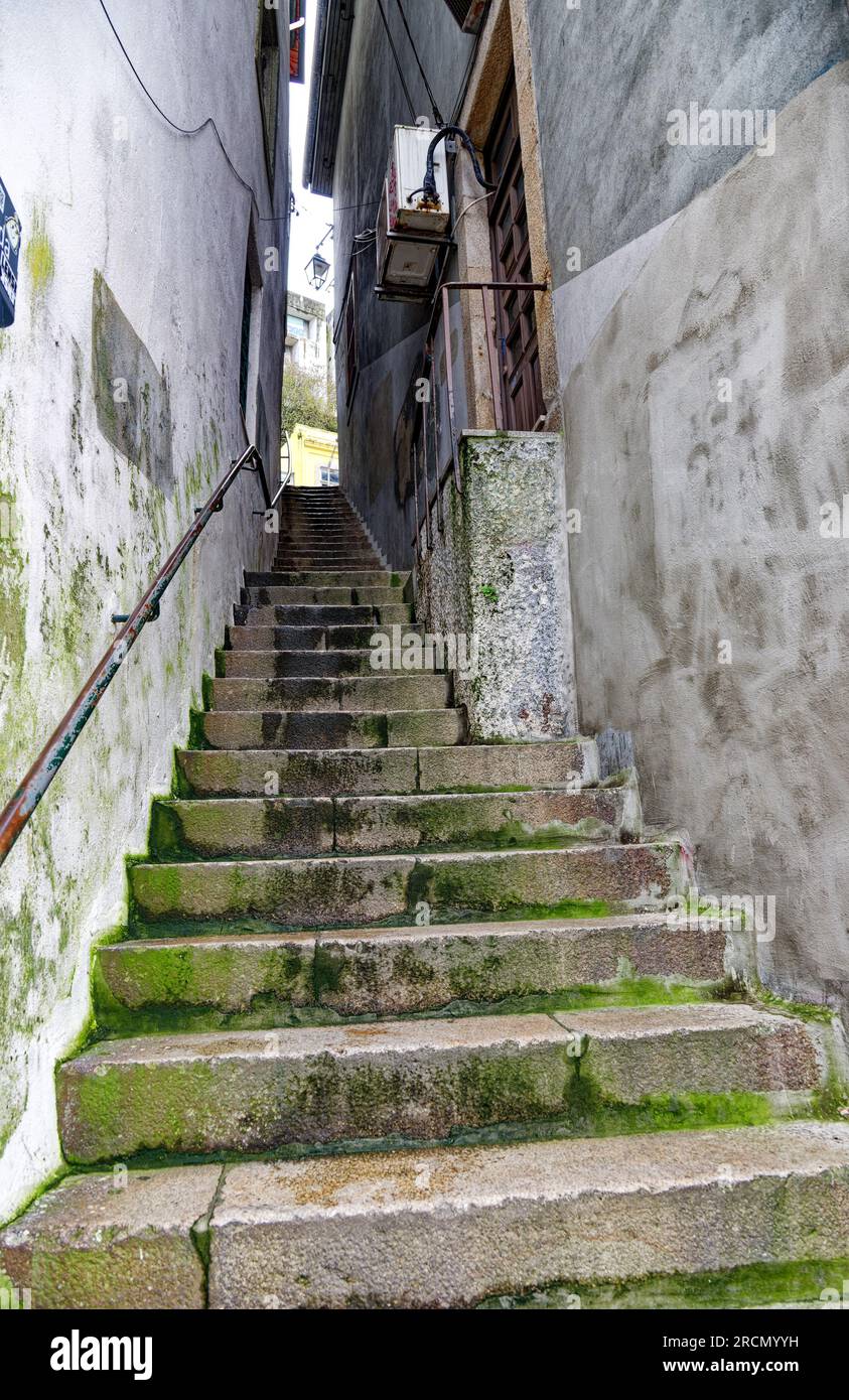 Narrow and steep passage with steps between two buildings in Gaia ...