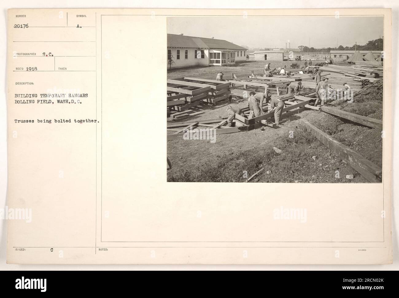 Workers assembling trusses for temporary hangars at Bolling Field in ...