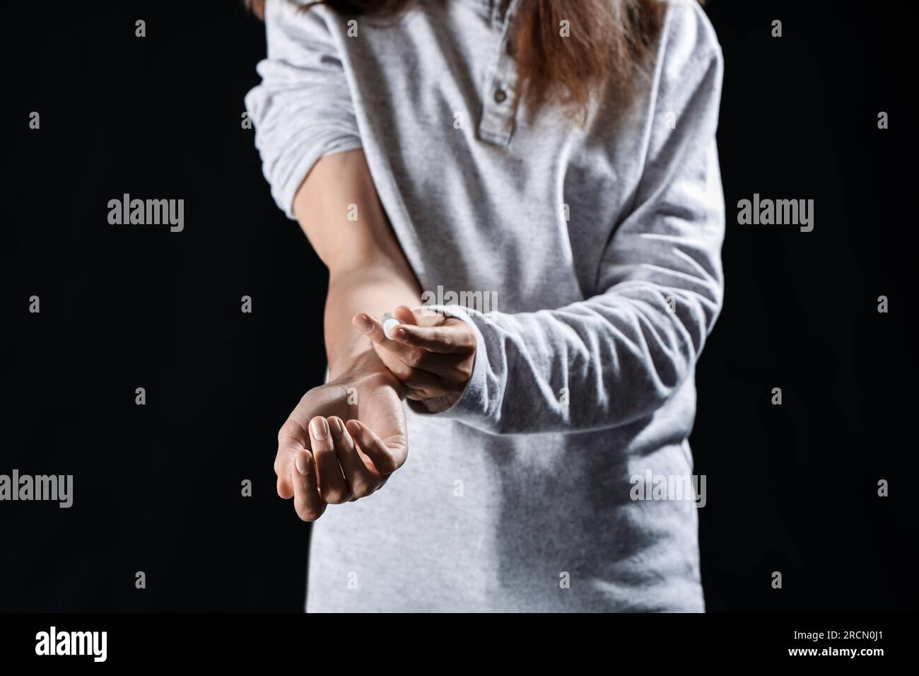 Female drug addict with syringe on black background, closeup Stock ...