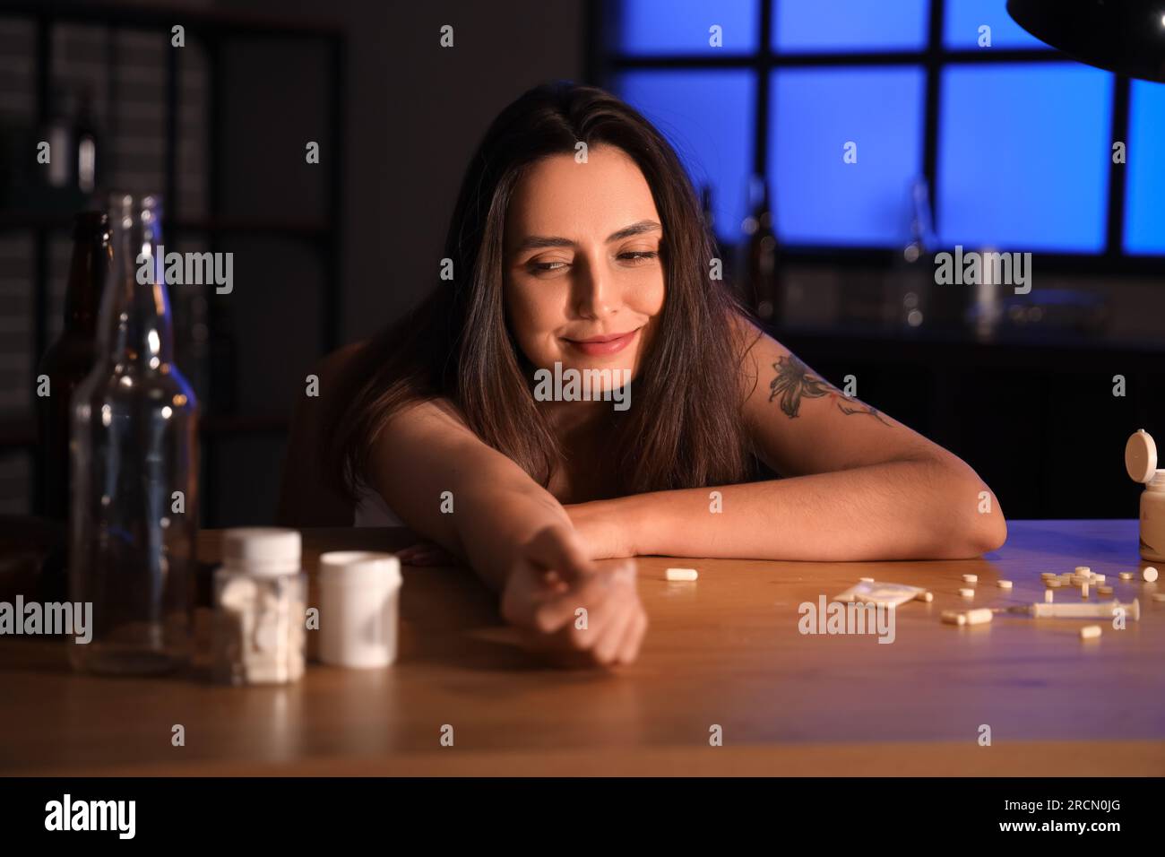 Female drug addict at home in evening Stock Photo - Alamy