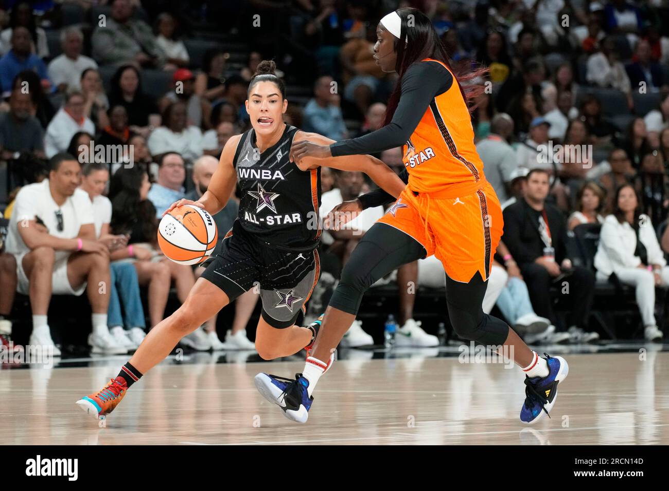 Las Vegas Aces' Kelsey Plum, of Team Wilson, drives around Chicago Sky's Kahleah Cooper, of Team ...