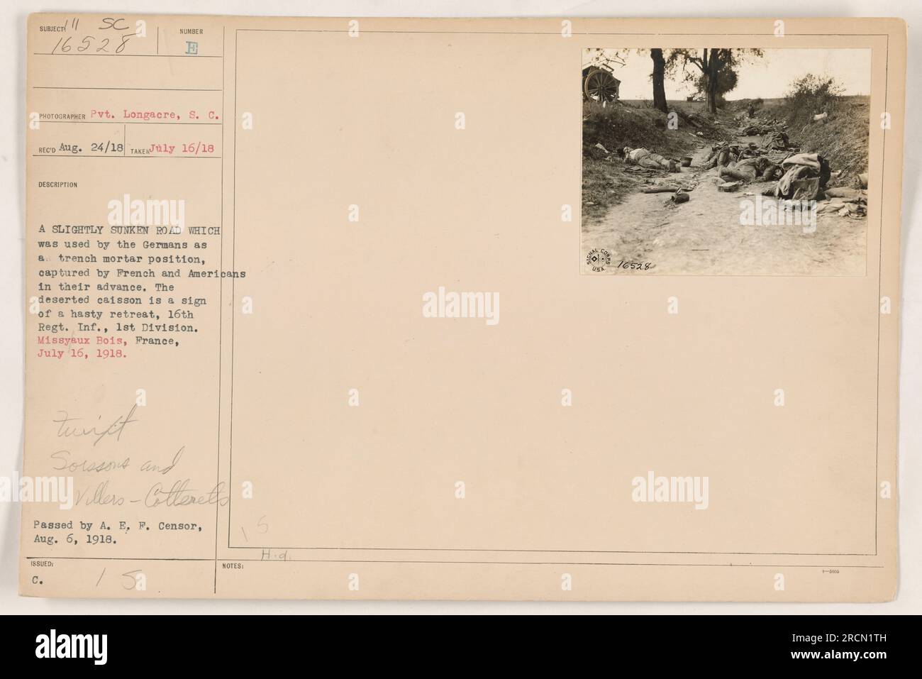 Soldiers inspect a deserted caisson on a slightly sunken road that was ...