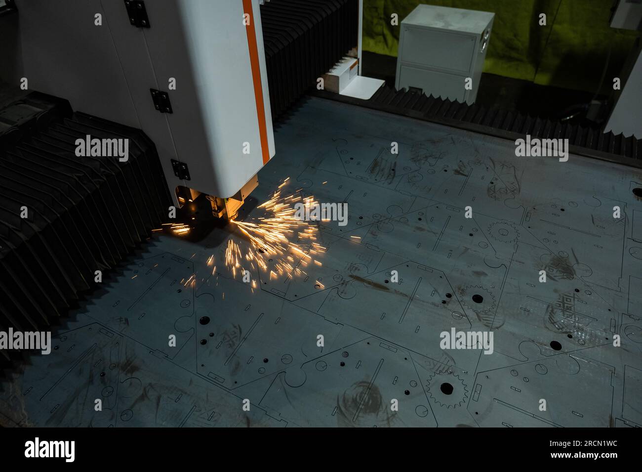 CNC machine. Laser cutting of metal. Sparks Stock Photo - Alamy