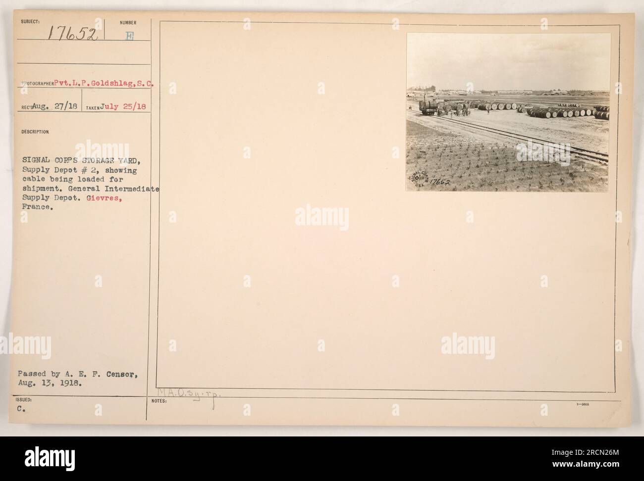 "A cable being loaded for shipment at the Signal Corps Storage Yard in ...