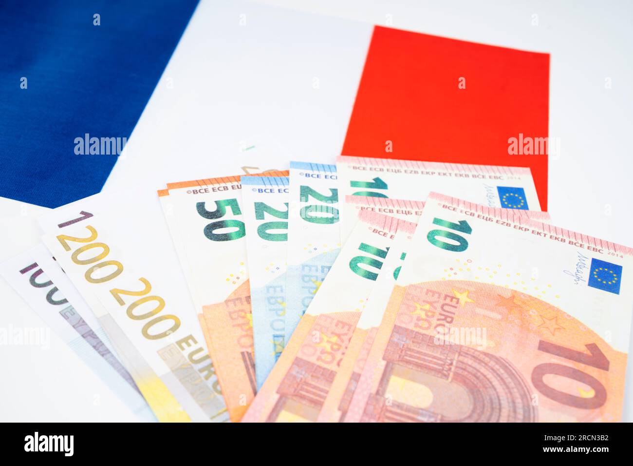 Euro banknote on France flag Stock Photo - Alamy