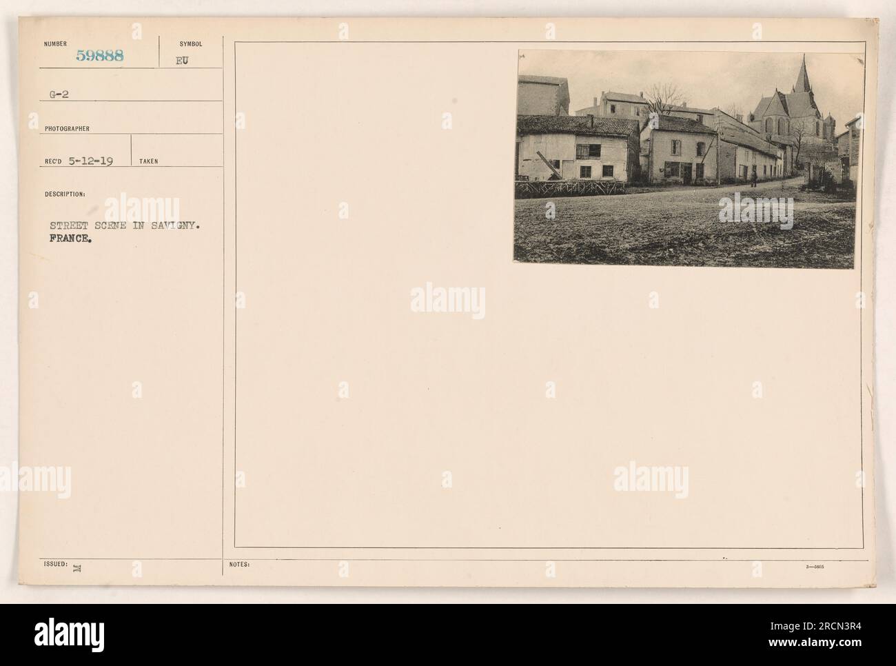 American soldiers walking through the streets of Savigny, France during ...