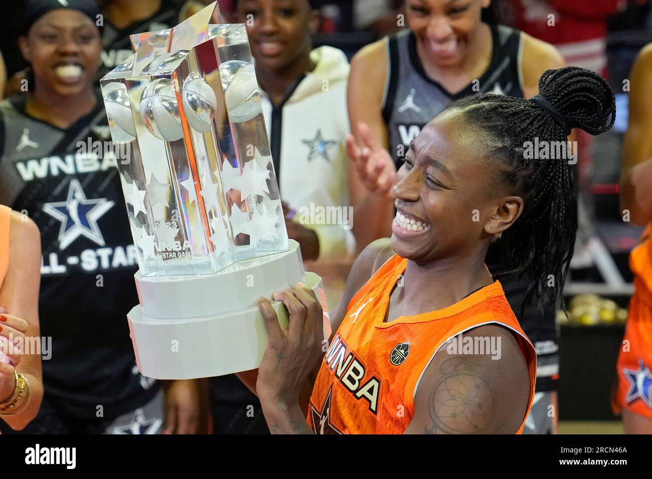 Seattle Storm's Jewell Loyd, of Team Stewart, holds up the MVP trophy ...