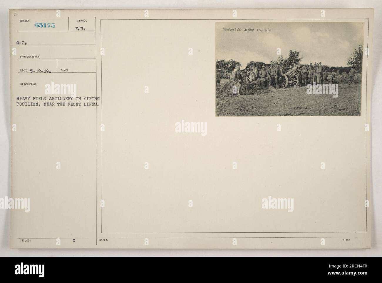 A heavy field artillery in a firing position near the front lines ...