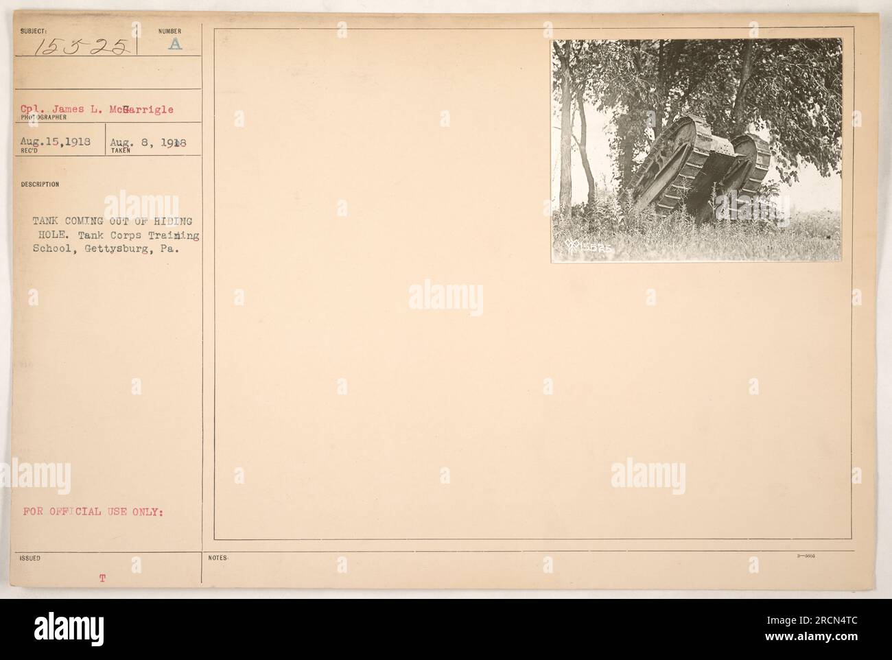 A tank emerges from a hiding hole at the Tank Corps Training School in ...