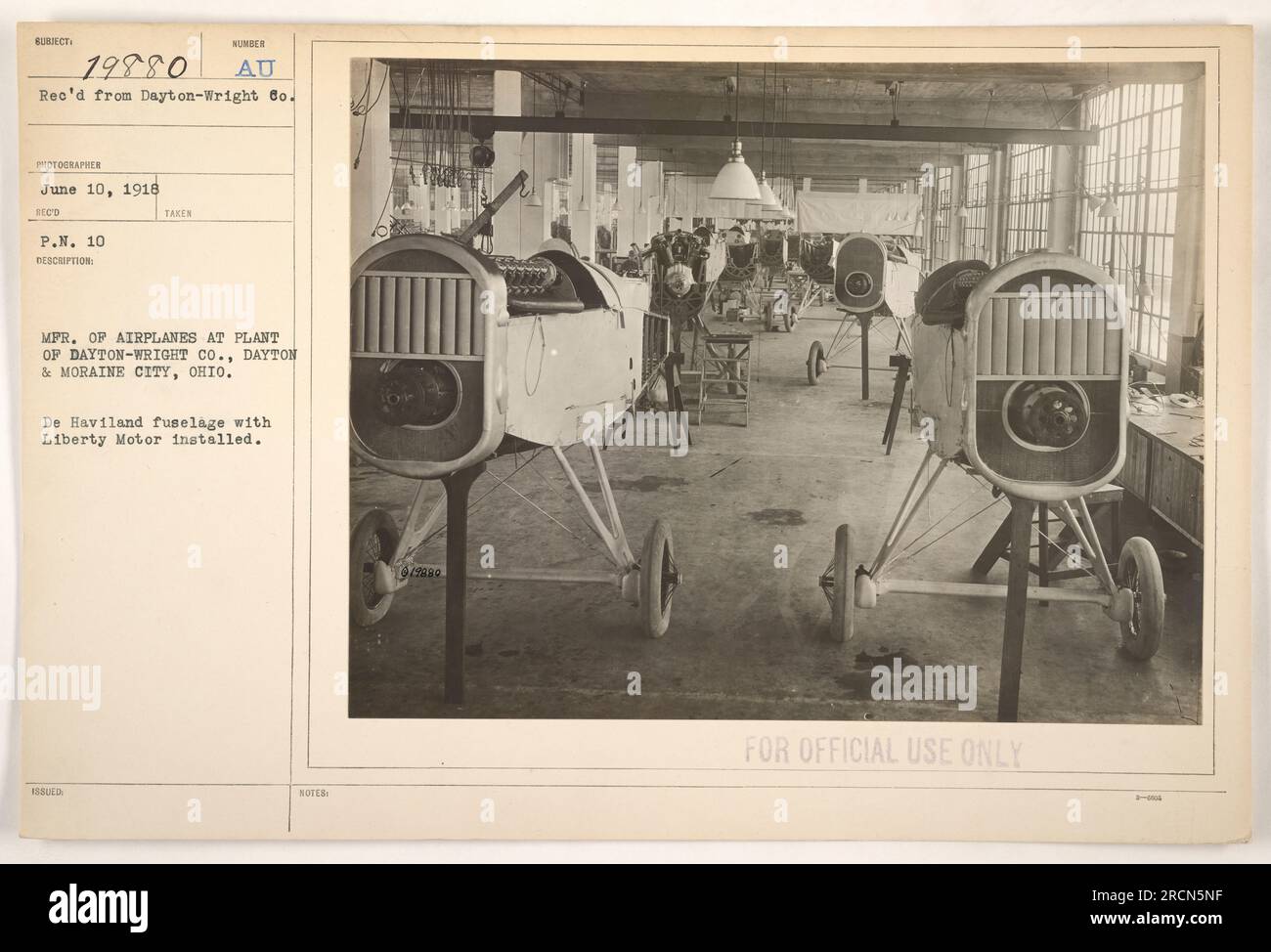 The image shows a De Haviland fuselage at the Dayton-Wright Co. plant ...