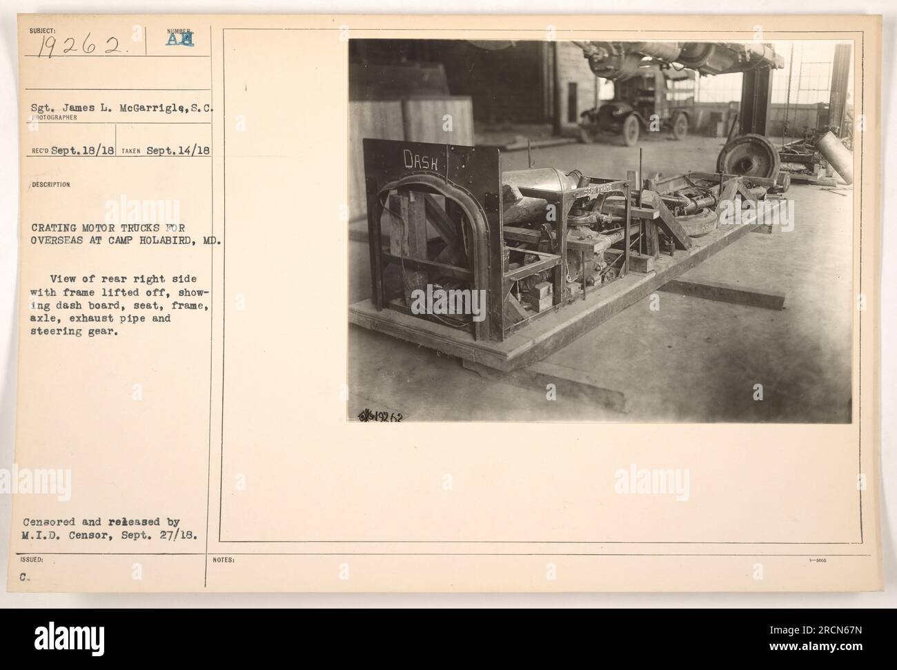 Caption: "Sgt. James L. McGarrigle and a group of soldiers seen crating ...