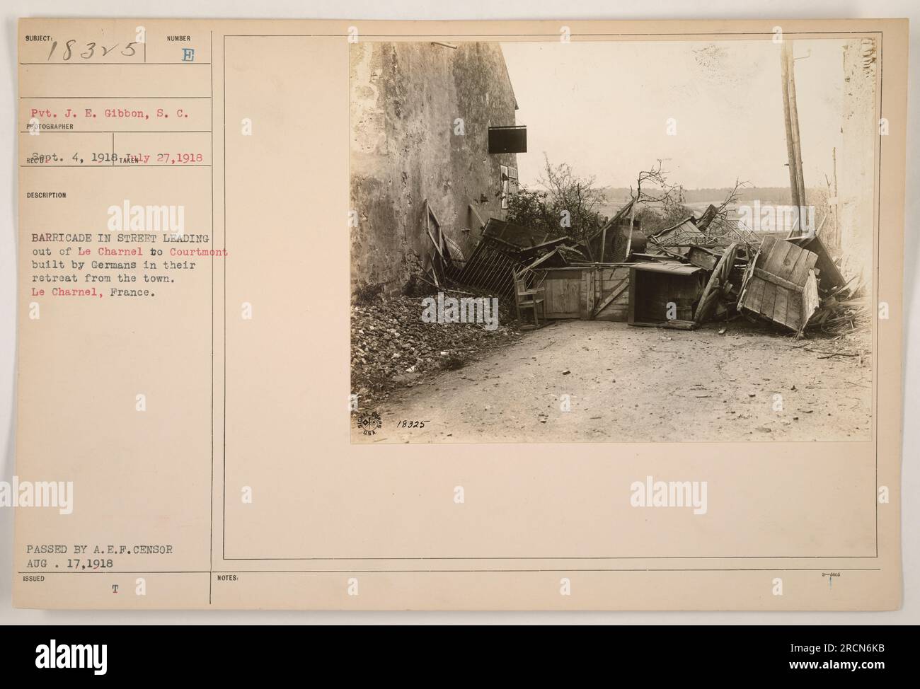 Caption: Pvt. J. E. Gibbon, S.C., photographed a barricade built by the ...