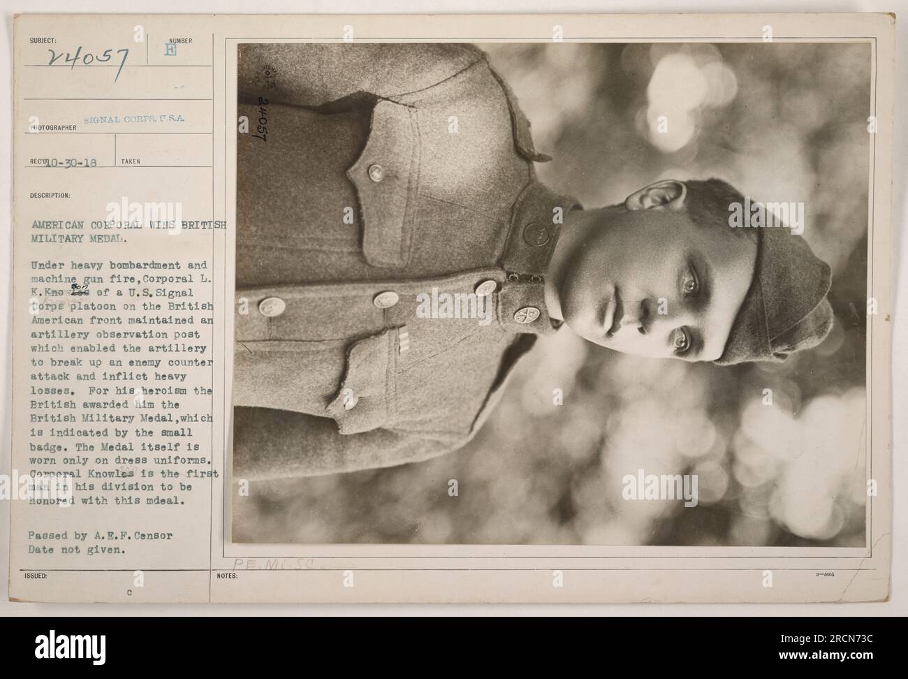 American Corporal L. K. Knowles of the U.S. Signal Corps receives the ...